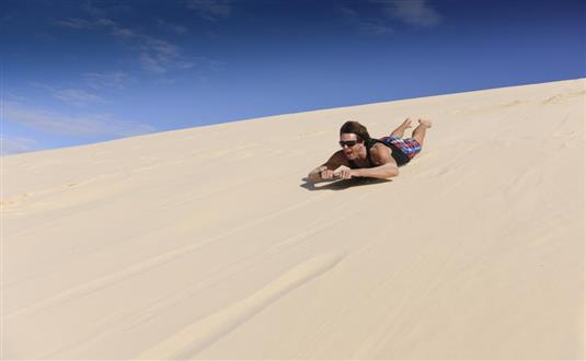 Sand Tobogganing Tour tour with Antilog Vacations at TANGALOOMA Australia